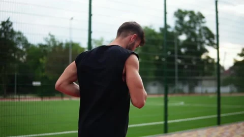 Side view of an athlete is running on ra... | Stock Video | Pond5