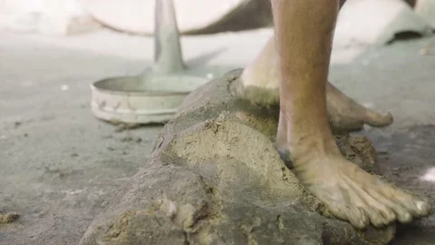 Side view of atrist mixing clay using le... | Stock Video | Pond5