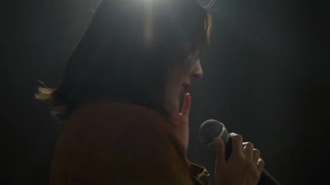 Side view Attractive singer woman singin... | Stock Video | Pond5