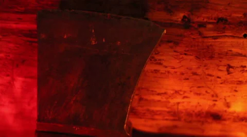 side view of an axe under a red-lighted ... | Stock Video | Pond5