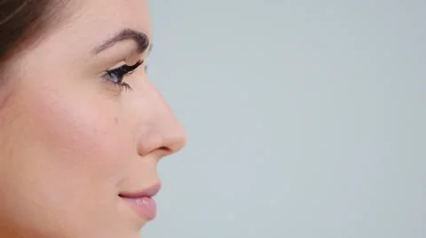 Side View on Beautiful Woman Face Posing... | Stock Video | Pond5