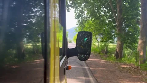 side view of a bus driving trough the fo... | Stock Video | Pond5