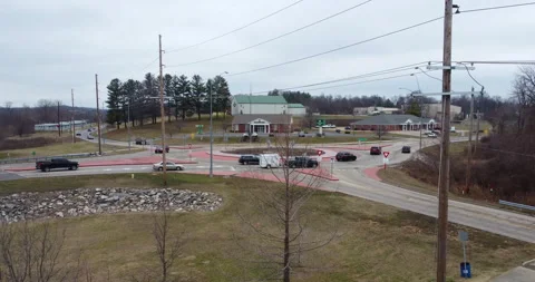 Side view busy roundabout with trees and... | Stock Video | Pond5