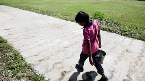side view of child’s student doing wat... | Stock Video | Pond5