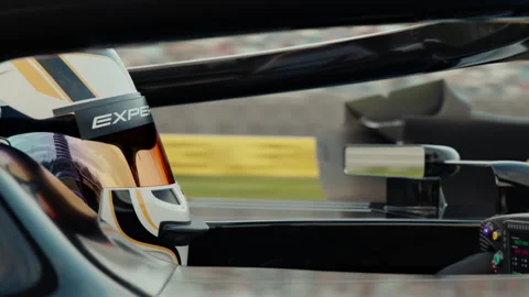 Side view close-up of a race car driver ... | Stock Video | Pond5