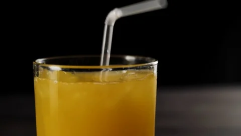 Side view of cocktail straw falling in f... | Stock Video | Pond5