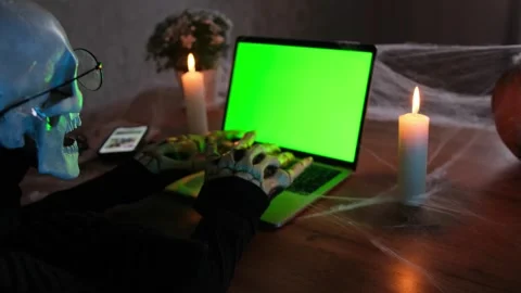 Side view death skeleton at laptop with ... | Stock Video | Pond5