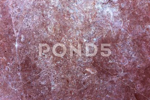 Photograph: Side view of the edge of the granite slab in bulk. A stack ...