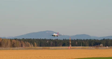 Side view of Embraer E190LR airplane lan... | Stock Video | Pond5