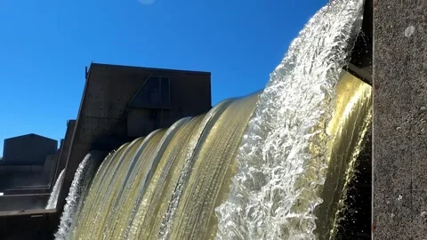 Side view of falling dam water foam fall... | Stock Video | Pond5