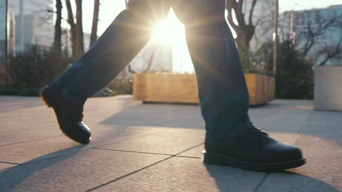 Side view following male feet steps walk... | Stock Video | Pond5