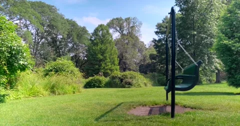 Side view of Hanging bench rocking chair... | Stock Video | Pond5