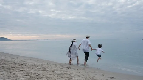 Side view Happy Asian Family running Han... | Stock Video | Pond5