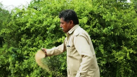 Side view Indian male person throwing bi... | Stock Video | Pond5