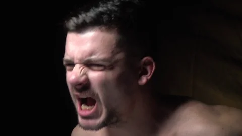 Side view as a man angrily screams | Stock Video | Pond5