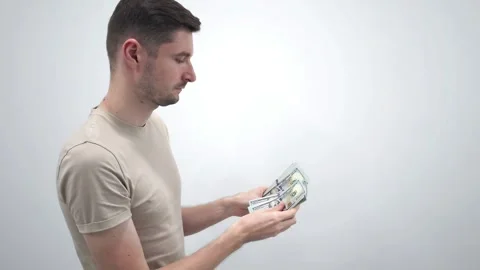 Side View of a Man Handling Cash in Stud... | Stock Video | Pond5