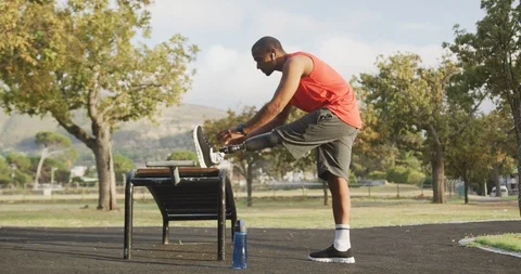 Side view man with prosthetic leg stretc... | Stock Video | Pond5