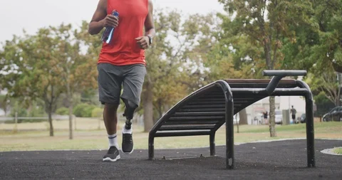 Side view man with prosthetic leg runnin... | Stock Video | Pond5