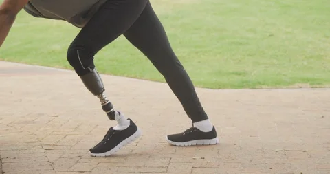 Side view man with prosthetic leg stretc... | Stock Video | Pond5