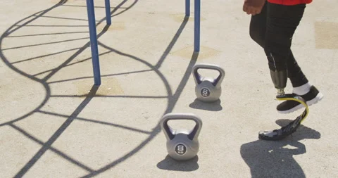 Side view man with prosthetic leg exerci... | Stock Video | Pond5