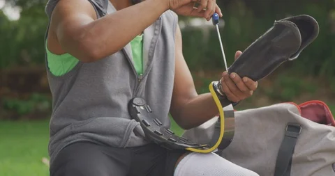 Side view man readjusting his prosthetic... | Stock Video | Pond5