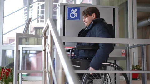 Side view man rolling wheelchair from li... | Stock Video | Pond5