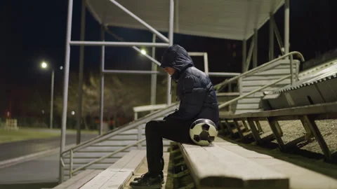 Side View of Man Sitting Alone with Socc... | Stock Video | Pond5