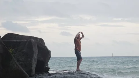 Side View Of Man Standing On One Leg The... | Stock Video | Pond5