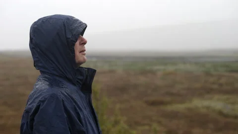 Side View Of A Man Standing In The Rain ... | Stock Video | Pond5