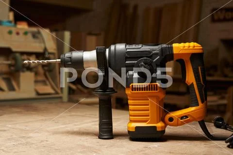 Side view of a modern electric rotary hammer with vertical motor ...