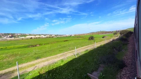 Side view from a moving train over the c... | Stock Video | Pond5