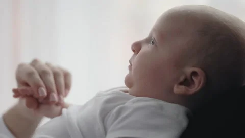 Side view of newborn baby boy lying on m... | Stock Video | Pond5