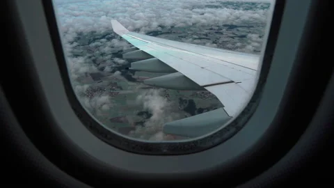 Side view from a plane window of the air... | Stock Video | Pond5