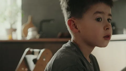 Side view portrait of a boy talking, smi... | Stock Video | Pond5