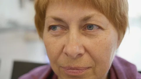 Side view portrait of old woman sitting ... | Stock Video | Pond5