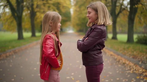 Side view positive girls talking standin... | Stock Video | Pond5