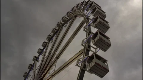 A side view of a rotating Ferris wheel a... | Stock Video | Pond5