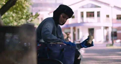 Side view sad homeless woman with paper ... | Stock Video | Pond5