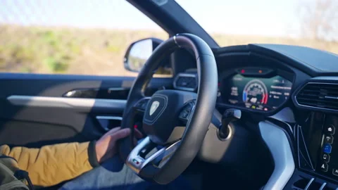 Side view shot of driver inside the spor... | Stock Video | Pond5