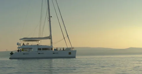 Side View Shot of a White Catamaran Sail... | Stock Video | Pond5