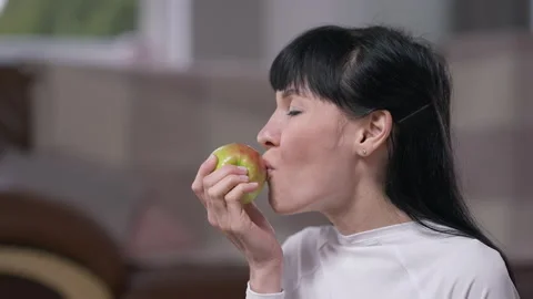 Side view slim woman with black hair bit... | Stock Video | Pond5