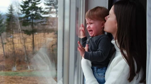 Side view of small baby girl crying sitt... | Stock Video | Pond5