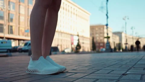 Side view teen female legs standing on p... | Stock Video | Pond5