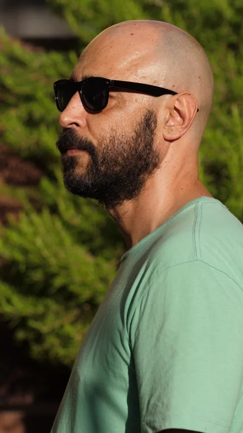 Side view of very thoughtful bald man wi... | Stock Video | Pond5