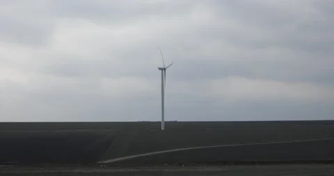 Side View Of A Wind Turbine Spinning In ... | Stock Video | Pond5