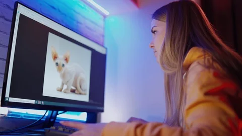 Side view of a woman in front of compute... | Stock Video | Pond5