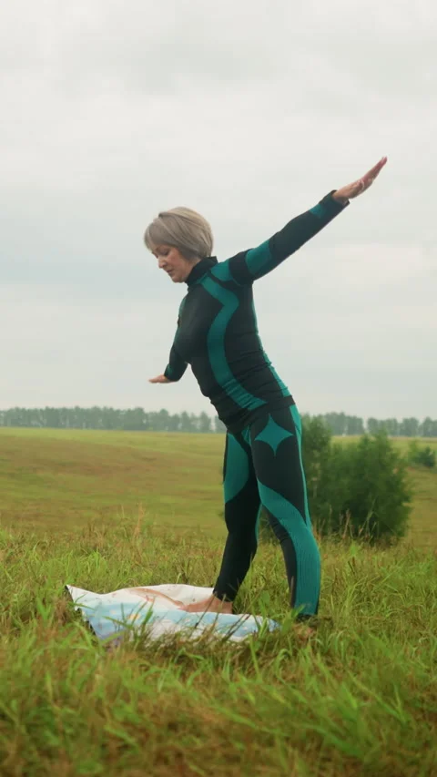 Side view of woman practicing triangle f... | Stock Video | Pond5