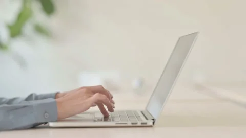 Side View of Woman Typing on Laptop Keyb... | Stock Video | Pond5