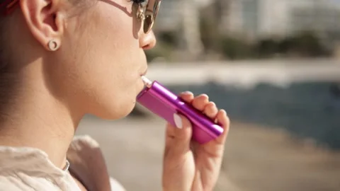 A Side View of a Woman Vaping at St. Pau... | Stock Video | Pond5