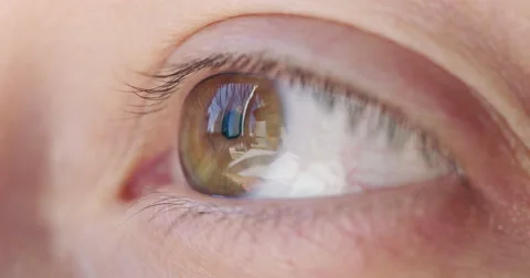 Side view of woman's brown eye reflectin... | Stock Video | Pond5